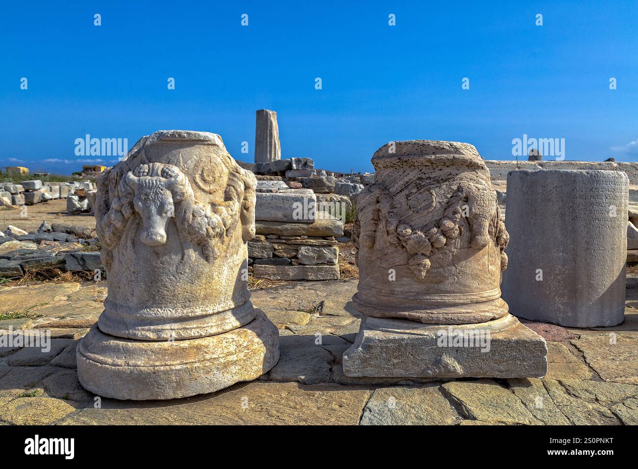 Ancient Ruins Sculpted Columns in Historical Site Under Clear Blue Sky, Delos, Greece Stock ...
