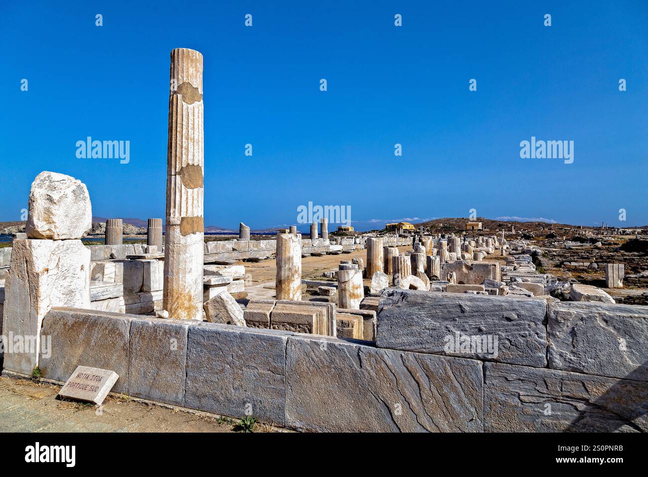 Ancient Ruins Under a Clear Sky Depicting Historical Stone Architecture ...