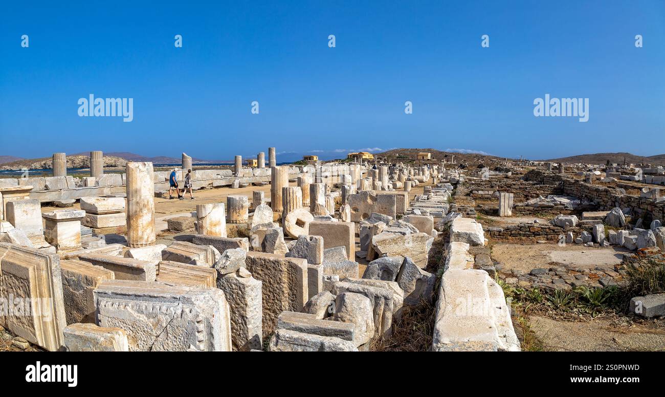 Ancient Ruins Under a Clear Sky Depicting Historical Stone Architecture ...