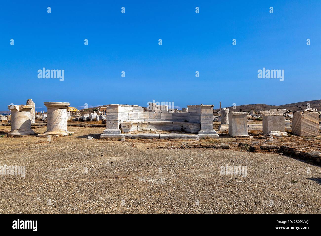 Ancient Ruins Under a Clear Sky Depicting Historical Stone Architecture ...