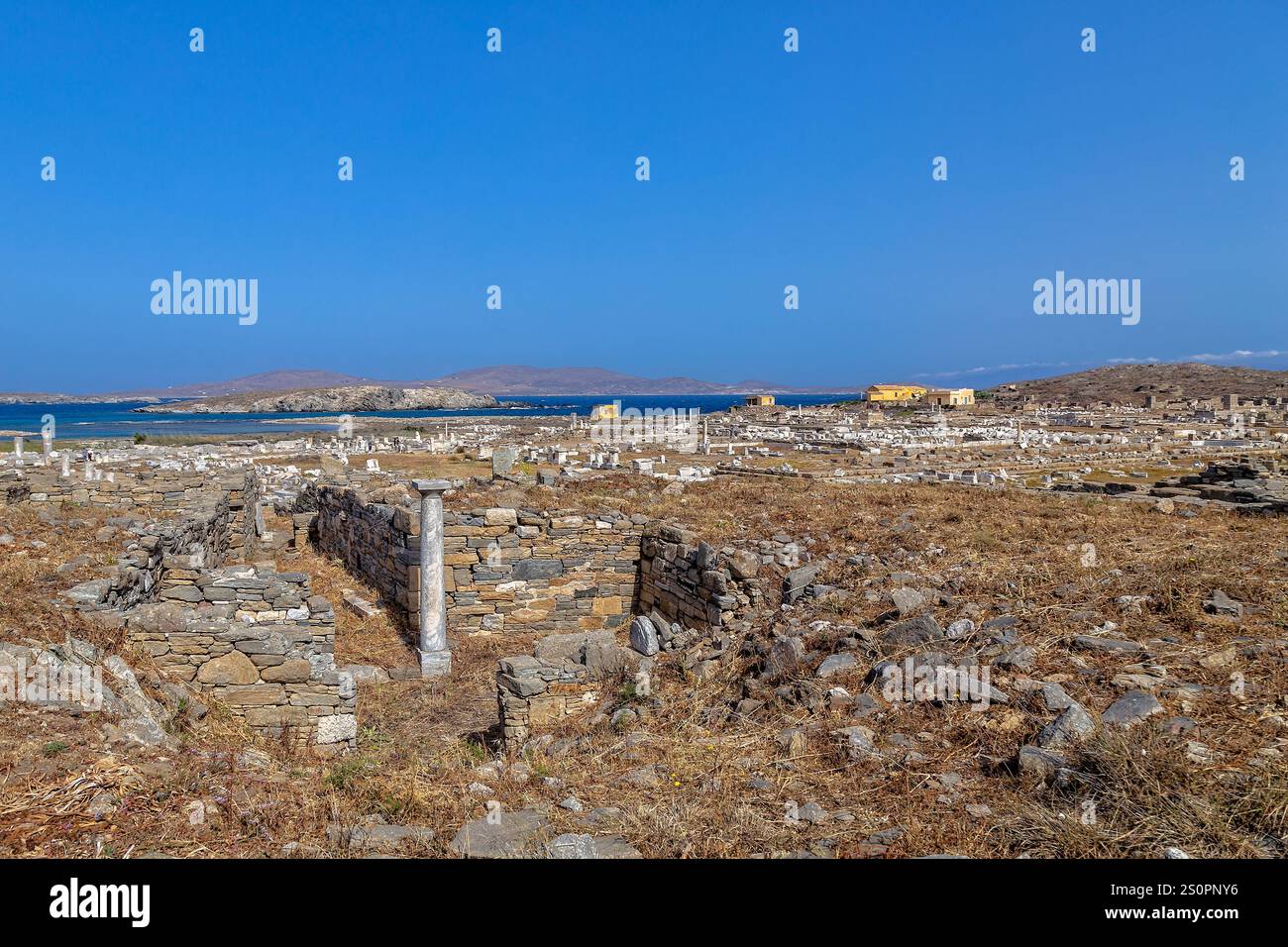 Ancient Stone Ruins with Ocean View Under a Clear Blue Sky, Delos, Greece Stock Photo - Alamy
