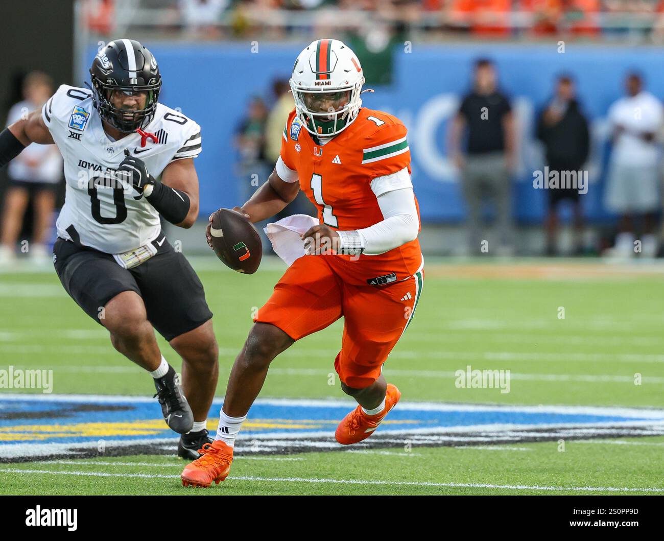 Orlando, FL, USA. 28th Dec, 2024. Miami QB Cam Ward (1) runs from the ...