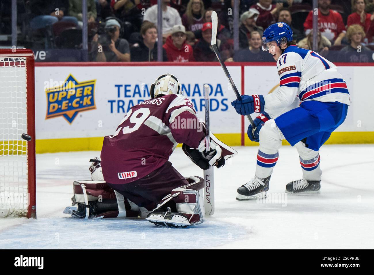 Goalkeeper Linards Feldbergs of, Latvia. , . and Danny Nelson of USA as ...