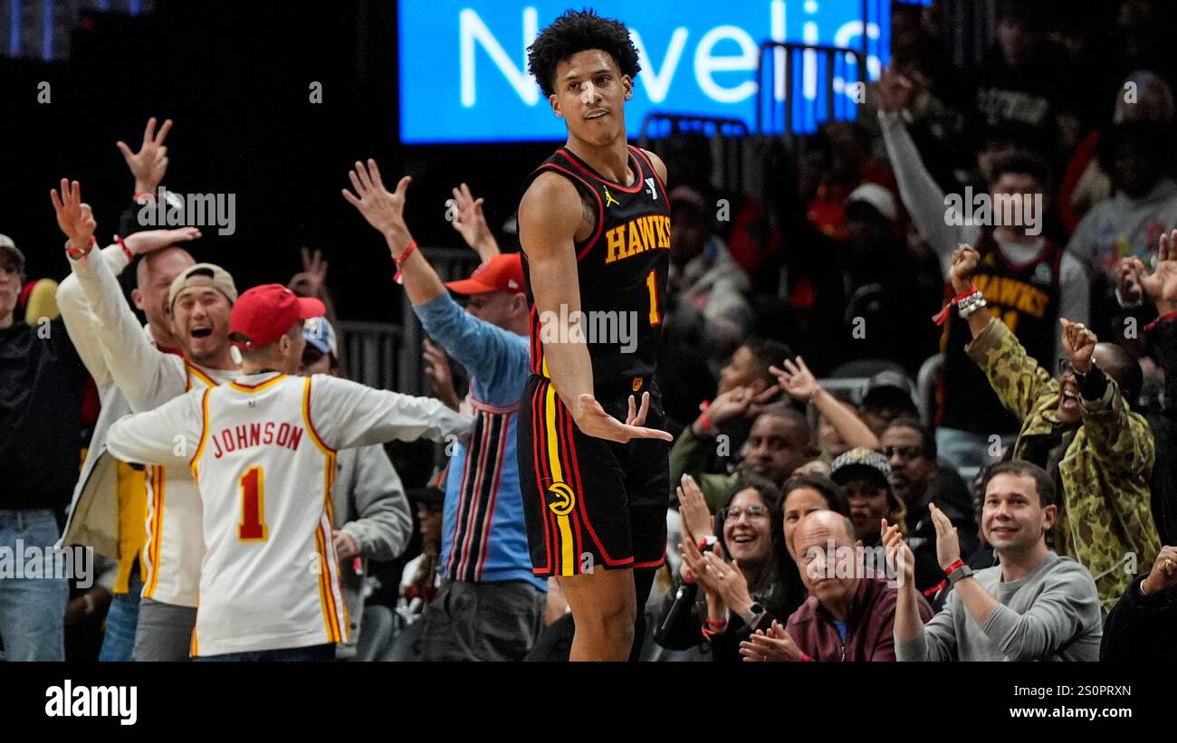 Atlanta Hawks forward Jalen Johnson (1) celebrates a three-point shot ...