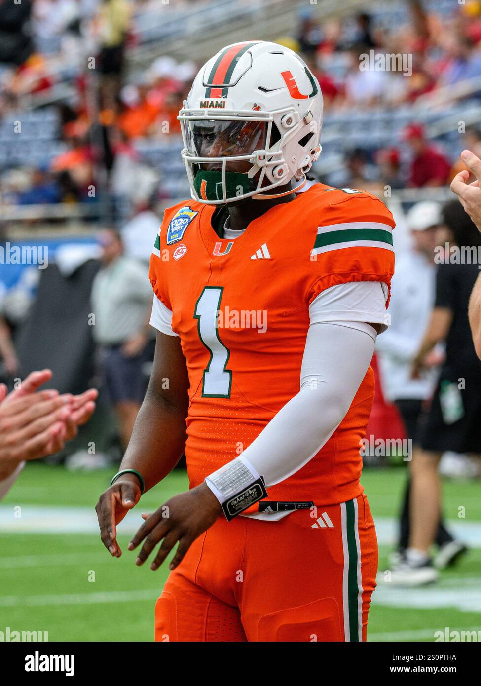 Orlando, FL, USA. 28th Dec, 2024. Miami Hurricanes quarterback Cam Ward ...