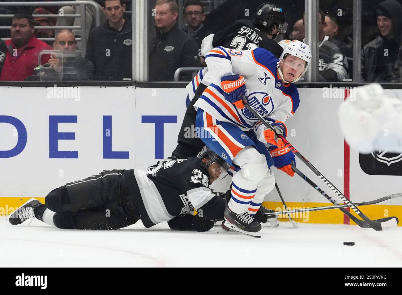 Edmonton Oilers center Mattias Janmark, right, takes the puck as Los Angeles Kings center Akil ...