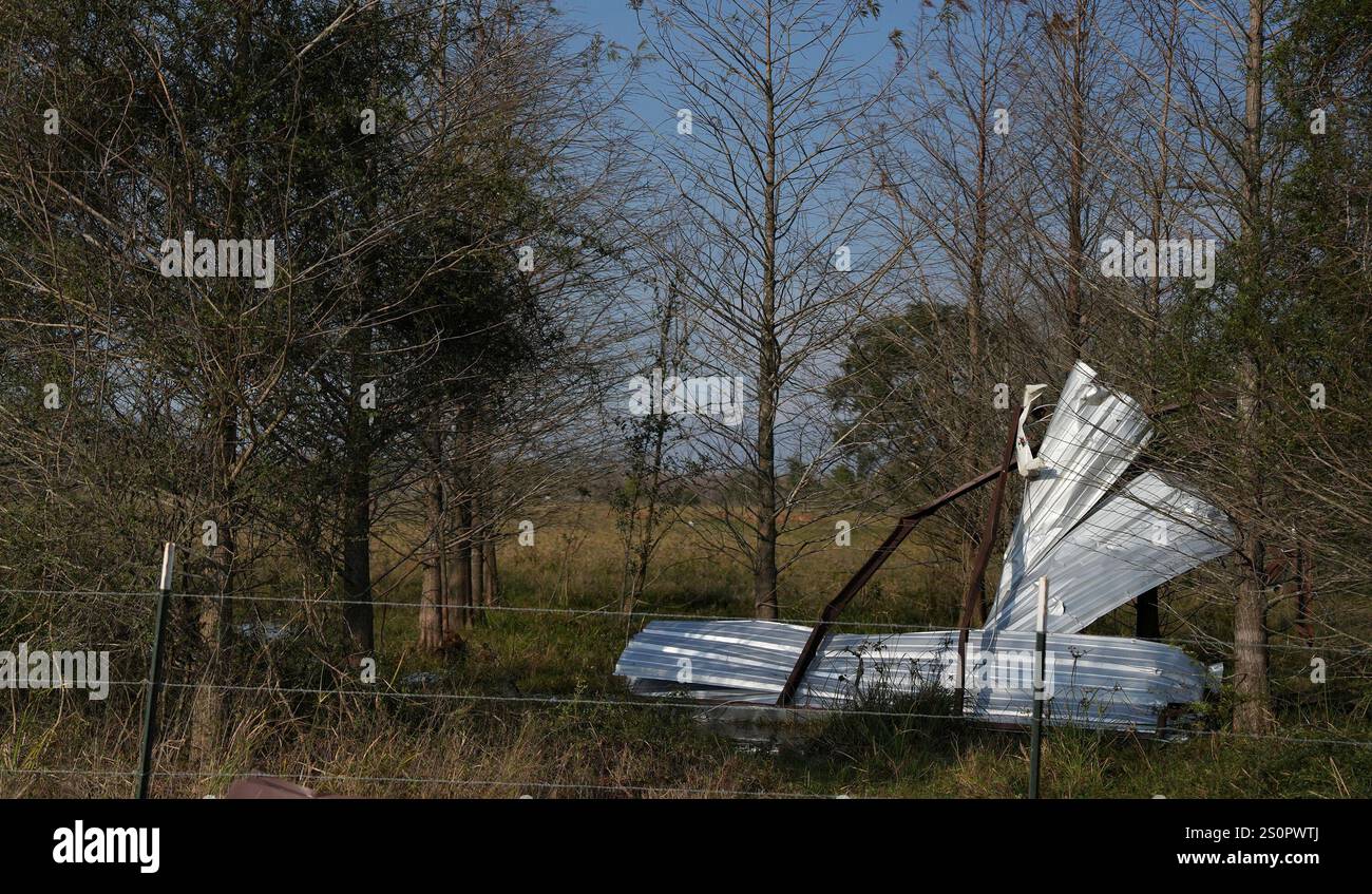 Debris sticks onto trees following a tornado that went through Katy ...