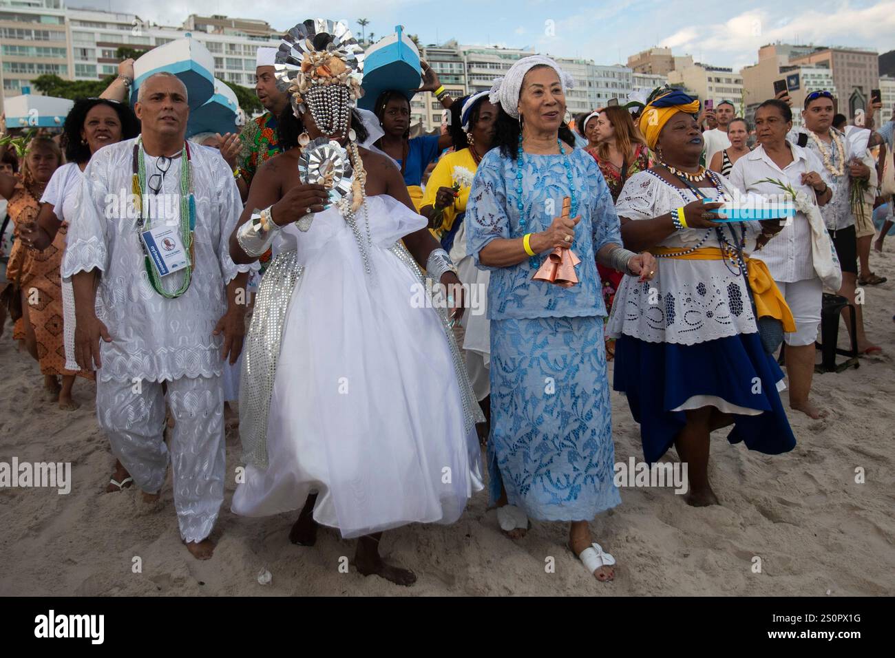 Devotees take part in a ceremony honoring Yemanja, a deity celebrated ...