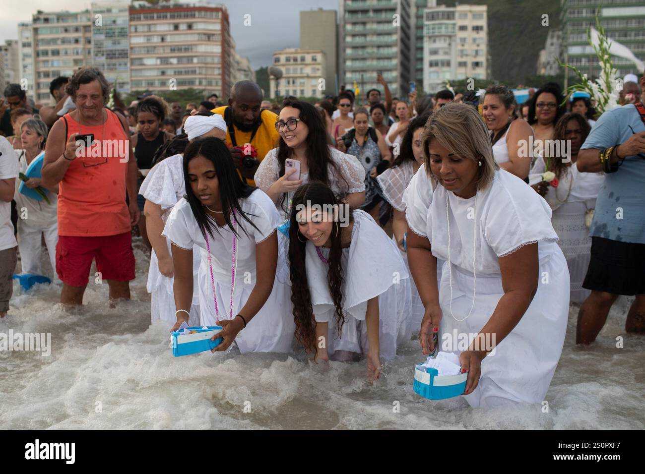Devotees send out to sea small-scaled boats filled with offerings for ...