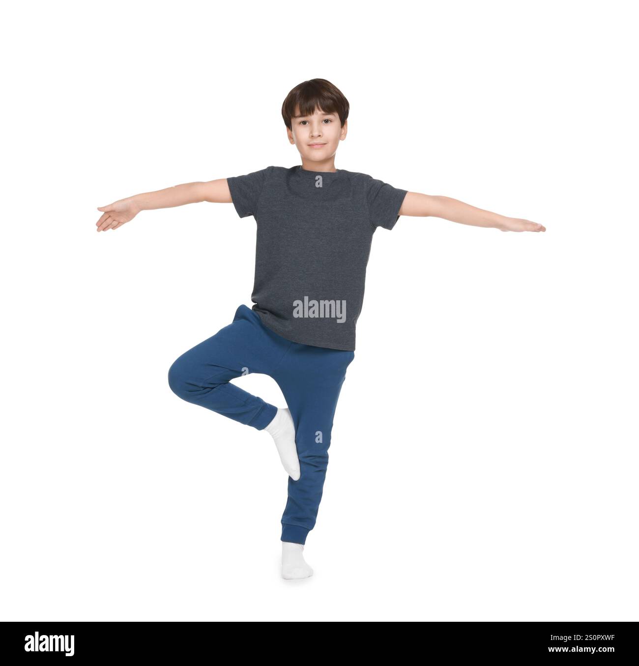 Boy doing exercise on white background. Sport activity Stock Photo - Alamy