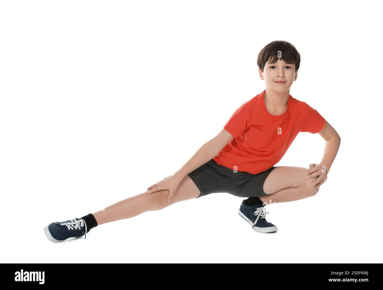 Boy doing exercise on white background. Sport activity Stock Photo - Alamy