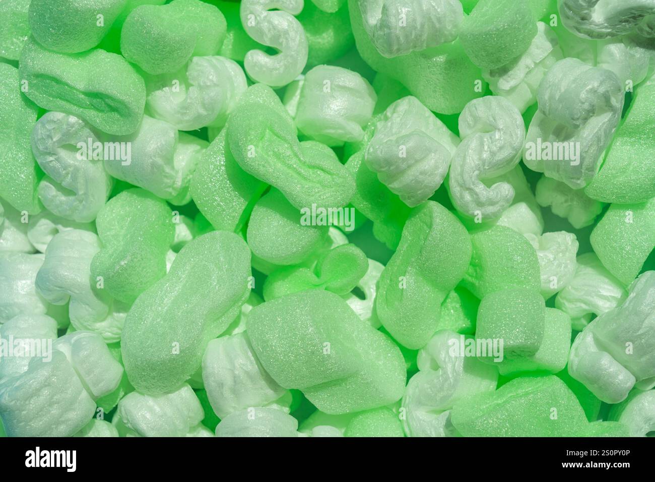 A detailed close-up of green and white packing peanuts, highlighting ...