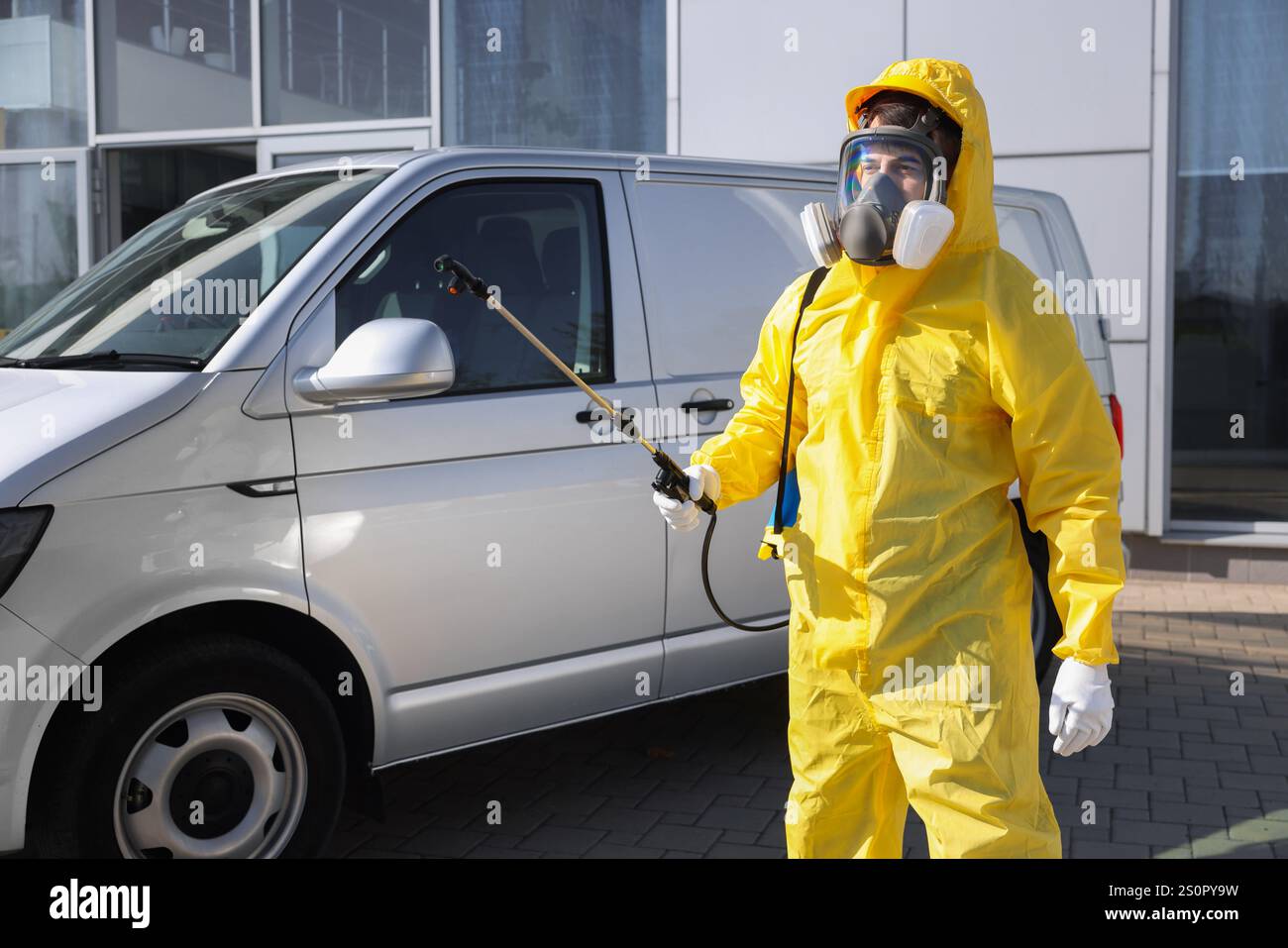Pest control worker with spray tank outdoors Stock Photo - Alamy