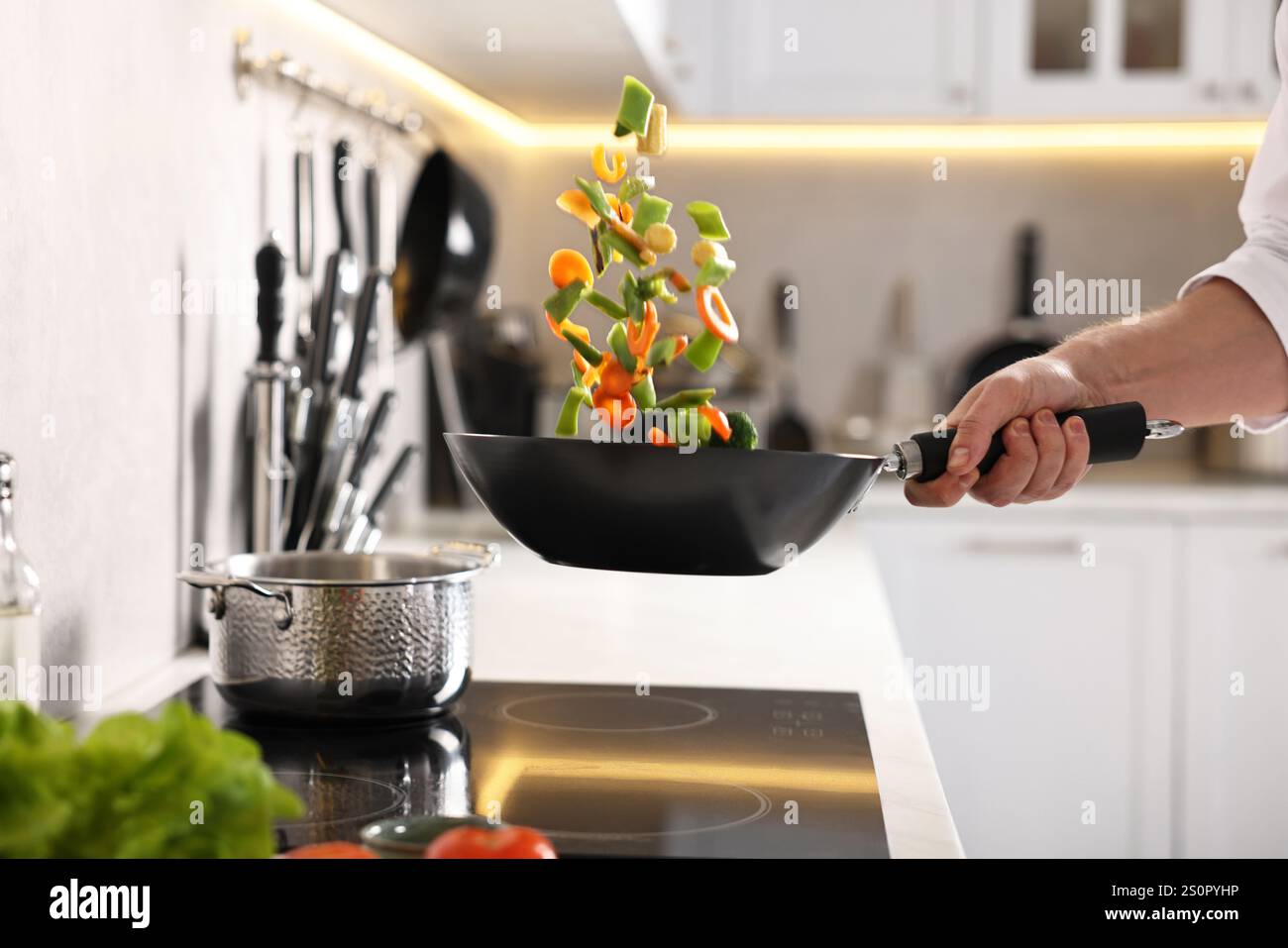Closeup male chef hands tossing hi-res stock photography and images - Alamy