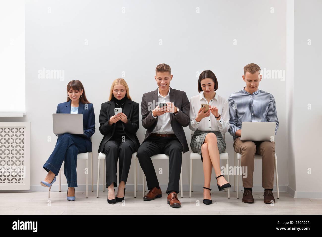 Group of people using different gadgets indoors. Modern technology ...