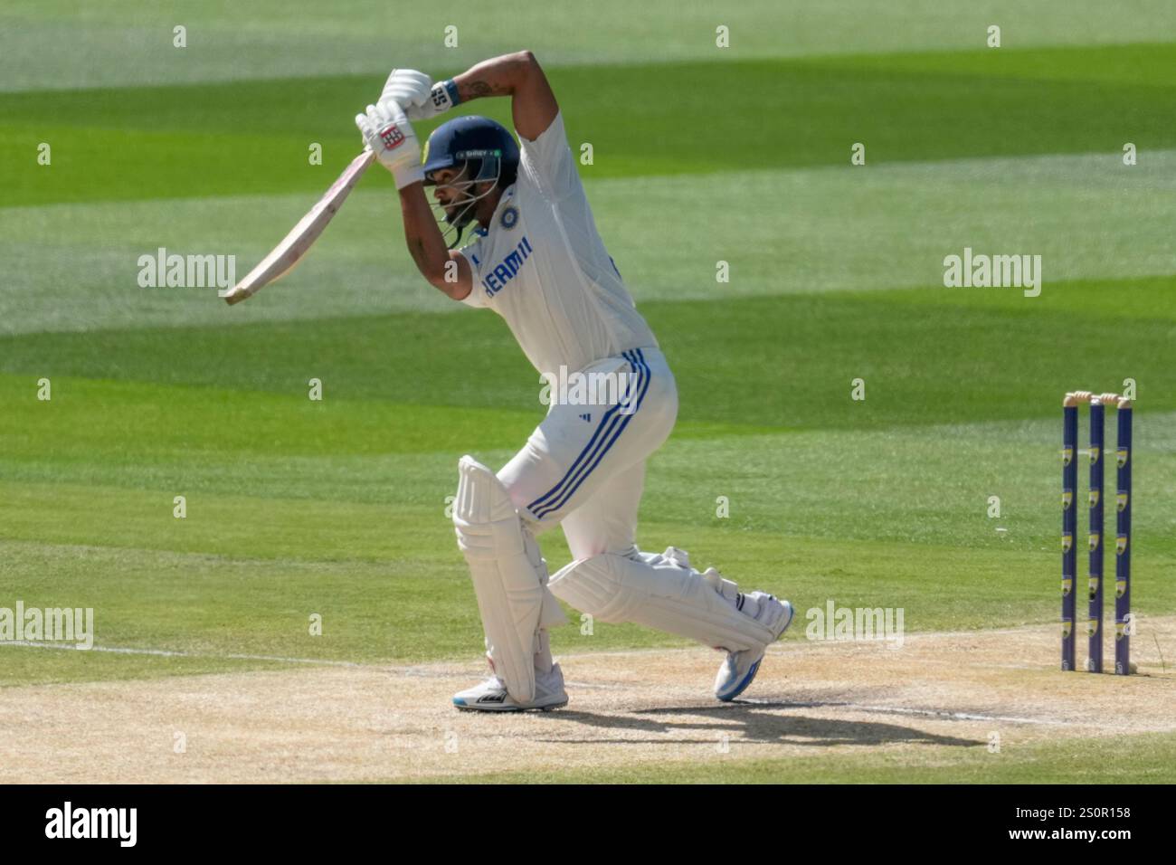 India's Nitish Kumar Reddy plays a shot during play on the day four of ...