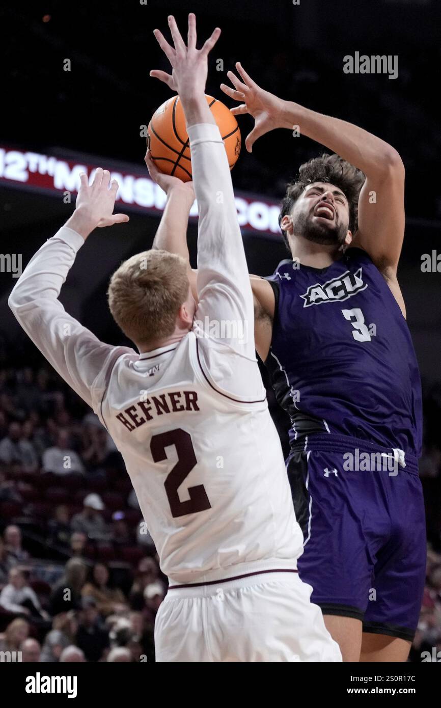 Abilene Christian forward Leonardo Bettiol (3) shoots over Texas A&M ...