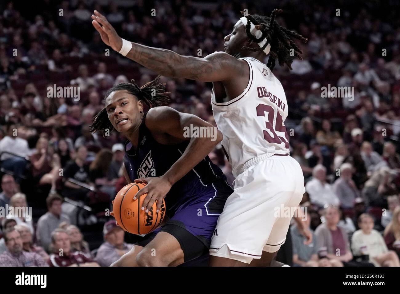 Abilene Christian guard Dontrez Williams (6) drives the lane against ...