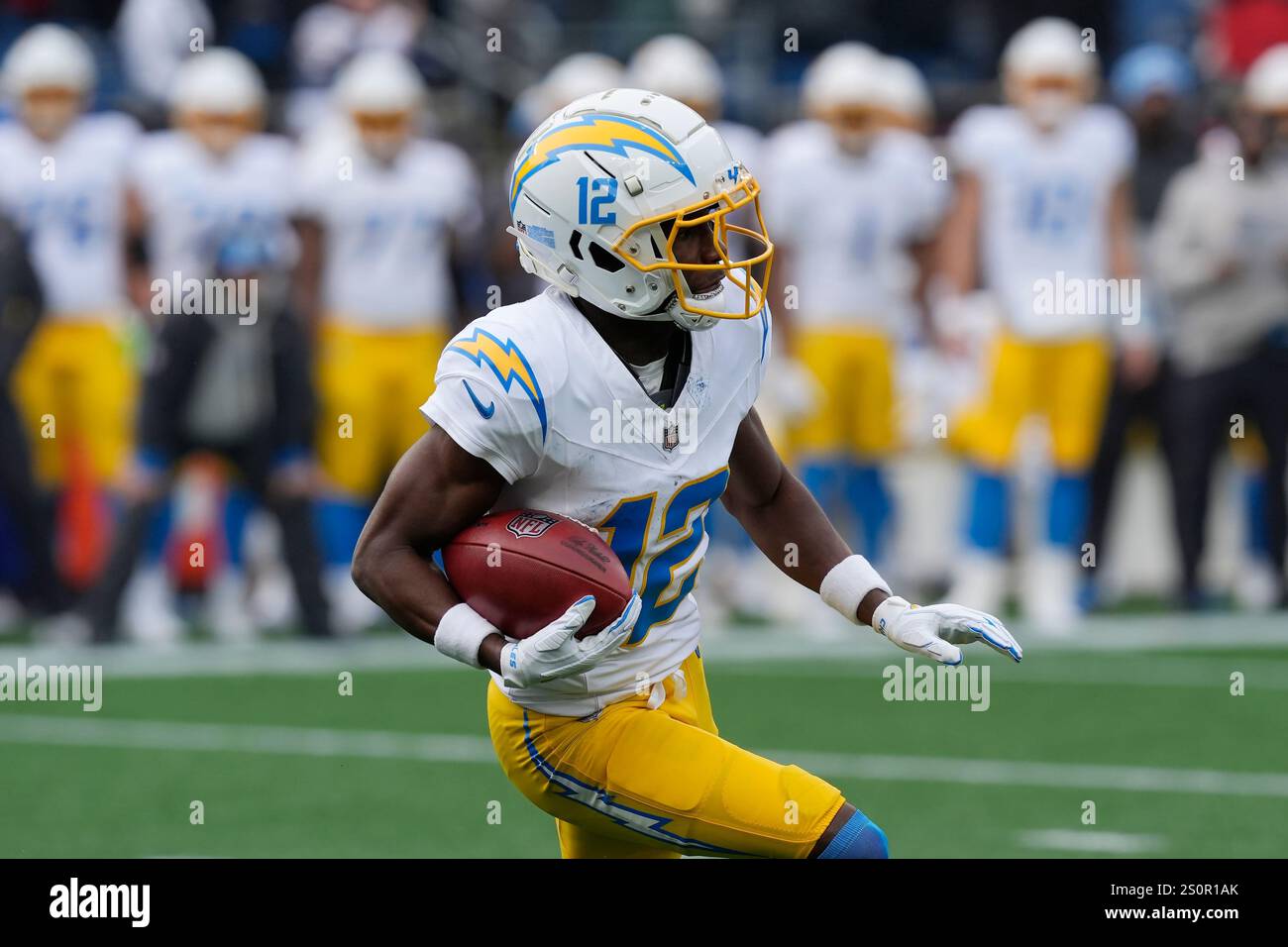 Los Angeles Chargers wide receiver Derius Davis carries the ball ...
