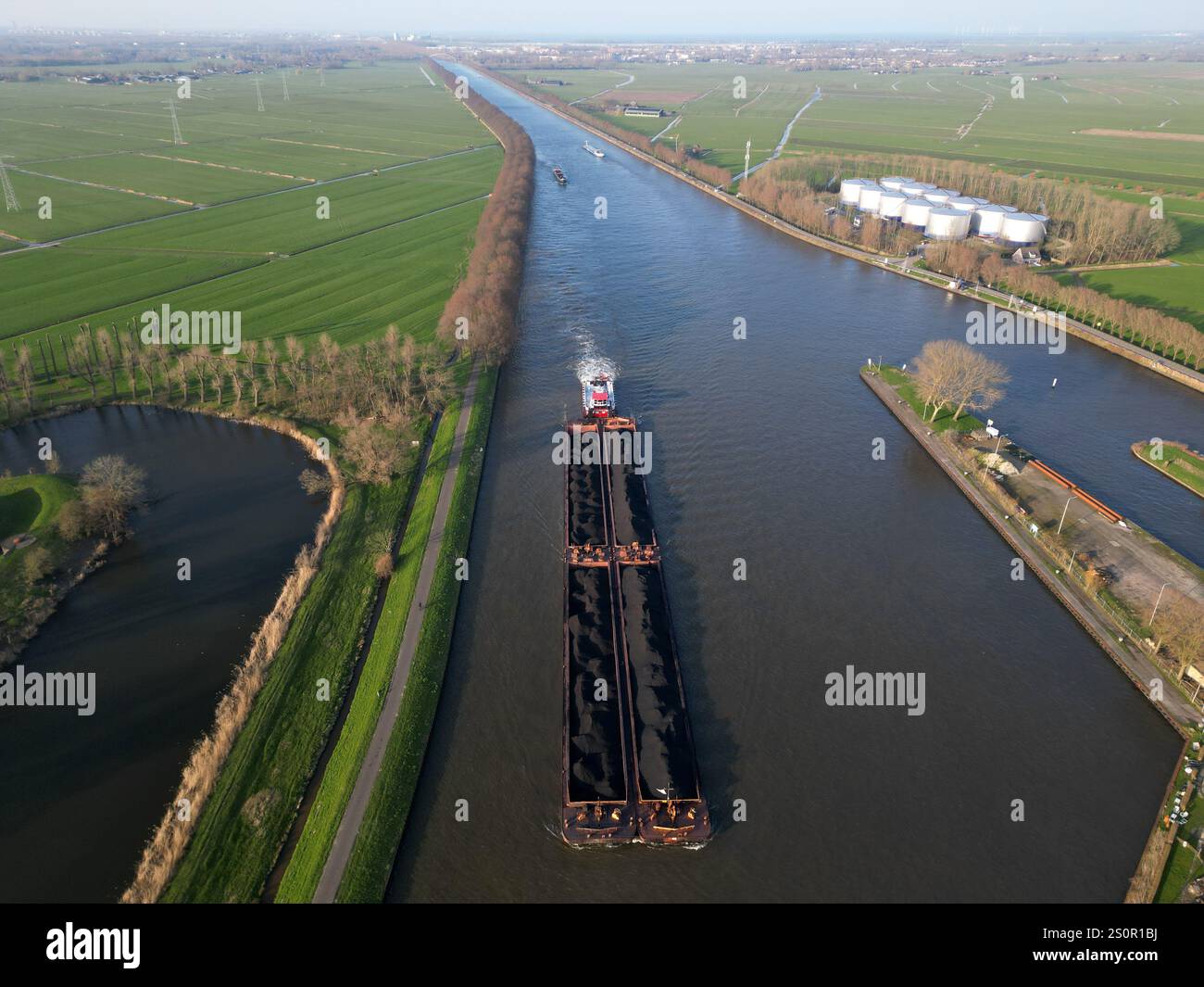 Aerial view of a tow boat and a ponton filled with coal on the ...
