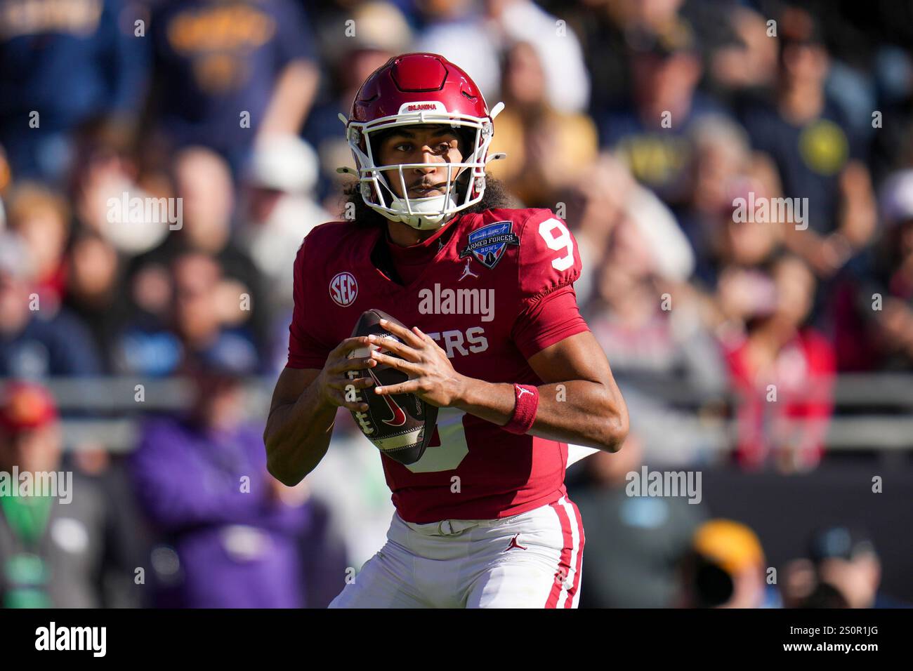 Oklahoma quarterback Michael Hawkins Jr. looks to pass against Navy ...