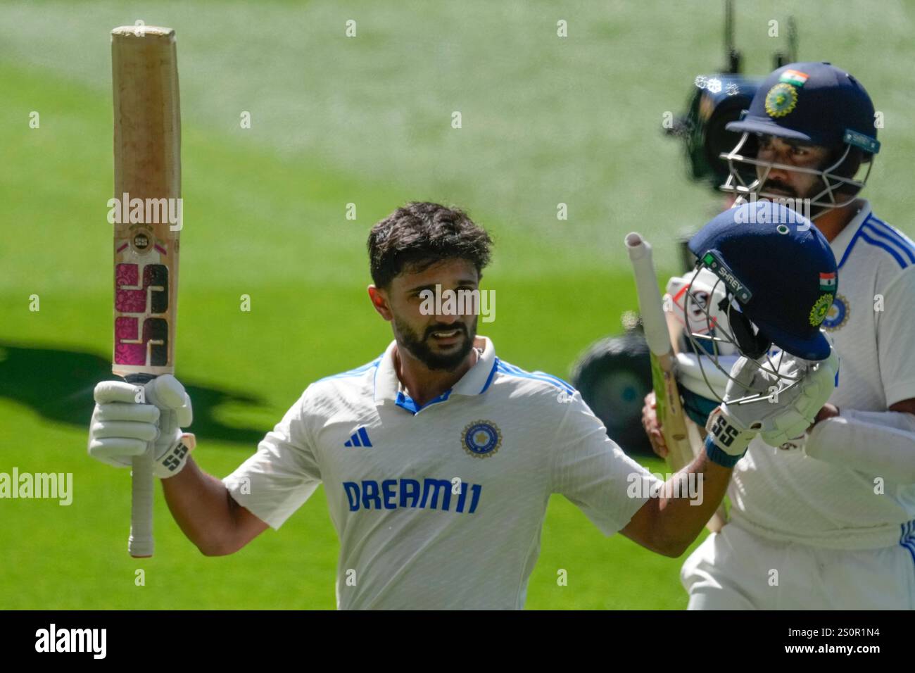 India's Nitish Kumar Reddy acknowledged the crowd as he walks off the ...