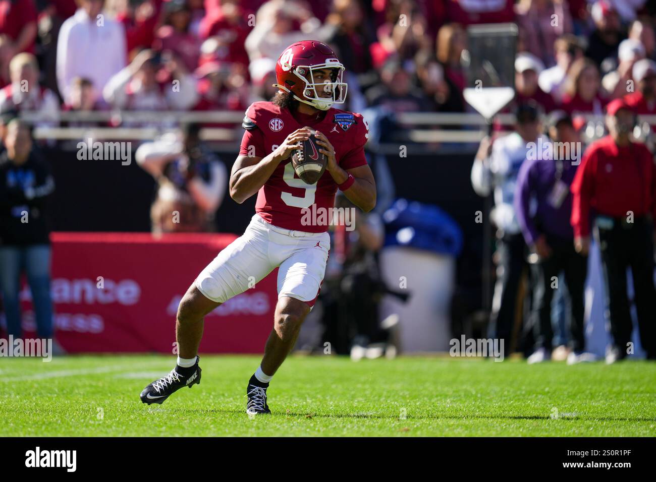 Oklahoma quarterback Michael Hawkins Jr. looks to pass against Navy ...