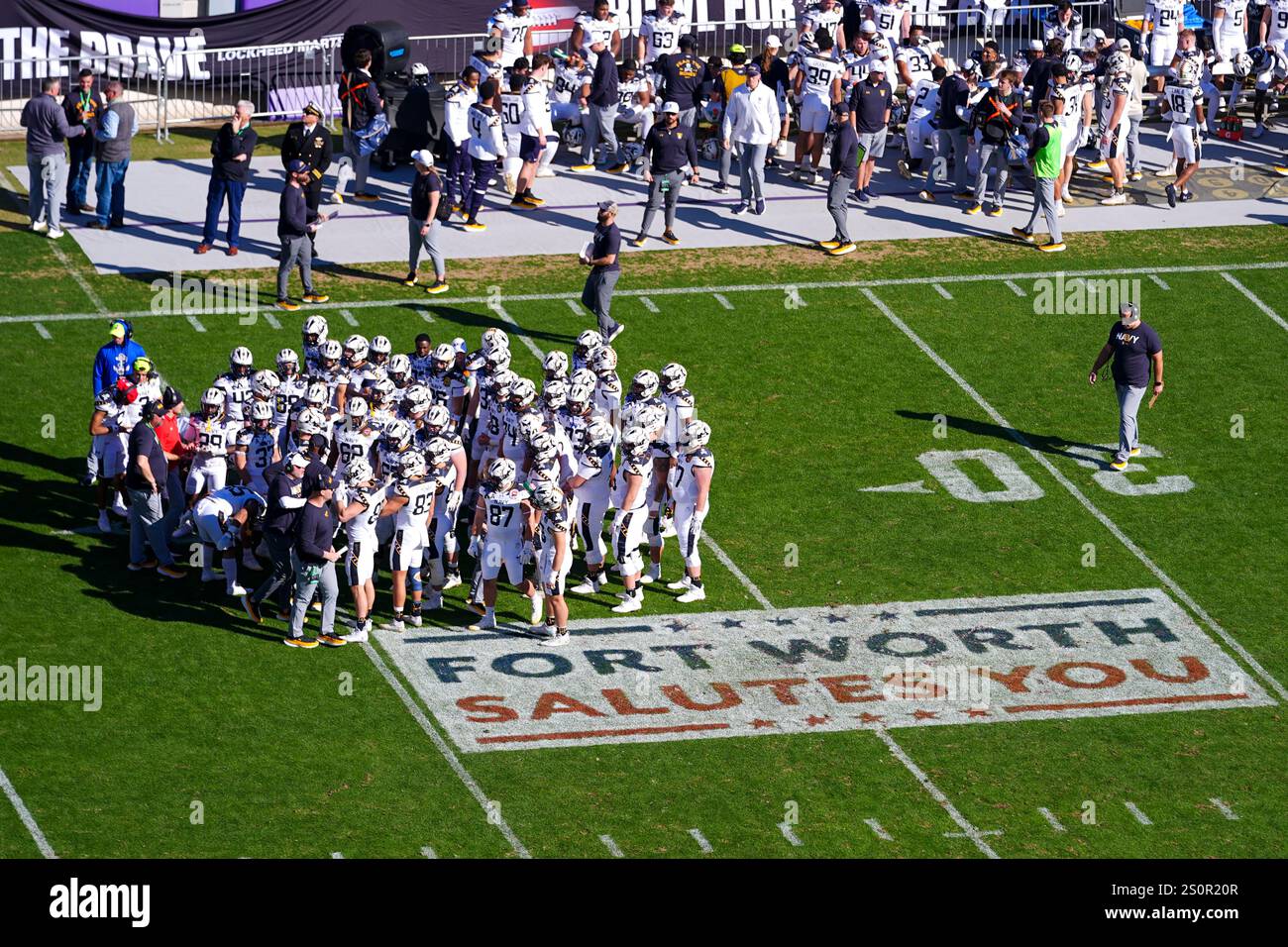 Navy players gather during the second half of the Armed Forces Bowl ...
