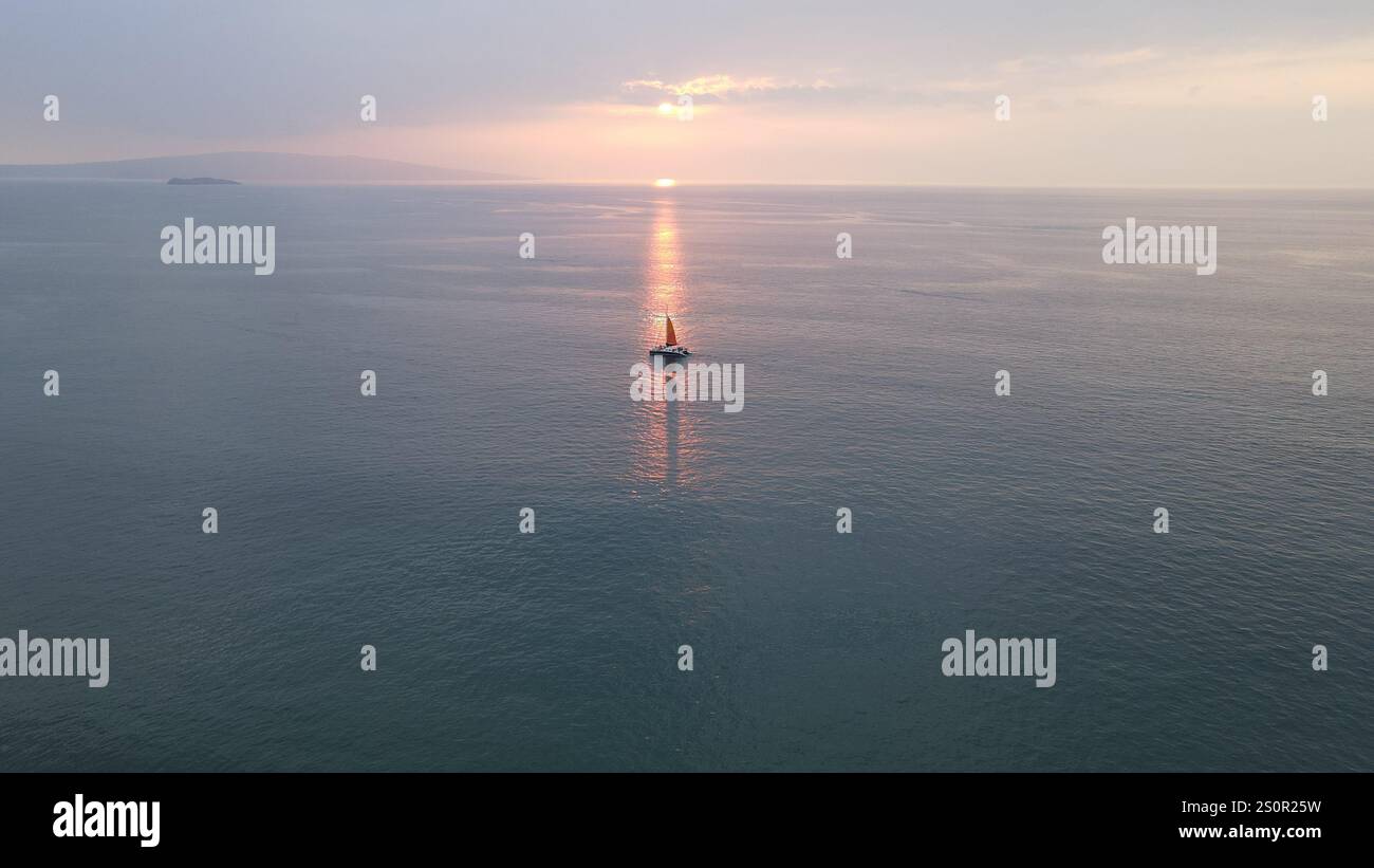 Chasing the horizon where the ocean meets the sky, with the sailboat ...