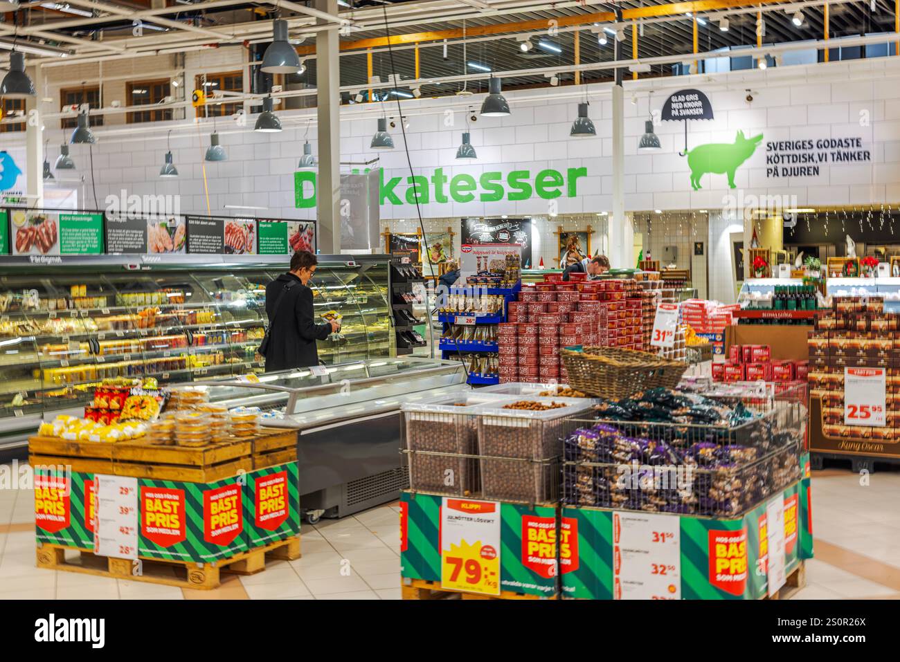 Supermarket delicatessen section with various products, festive ...
