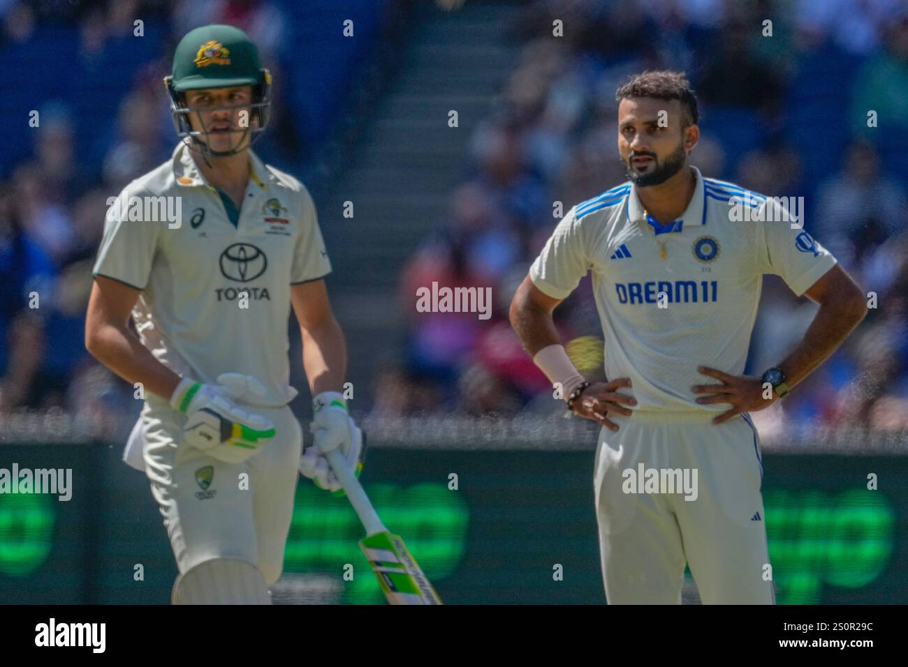 India's Akash Deep,right, reacts after Australia's Sam Konstas, left ...