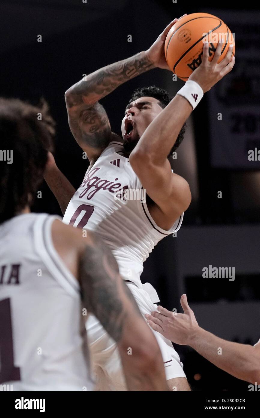 Texas A&M guard Jace Carter (0) makes a layup against Abilene Christian ...