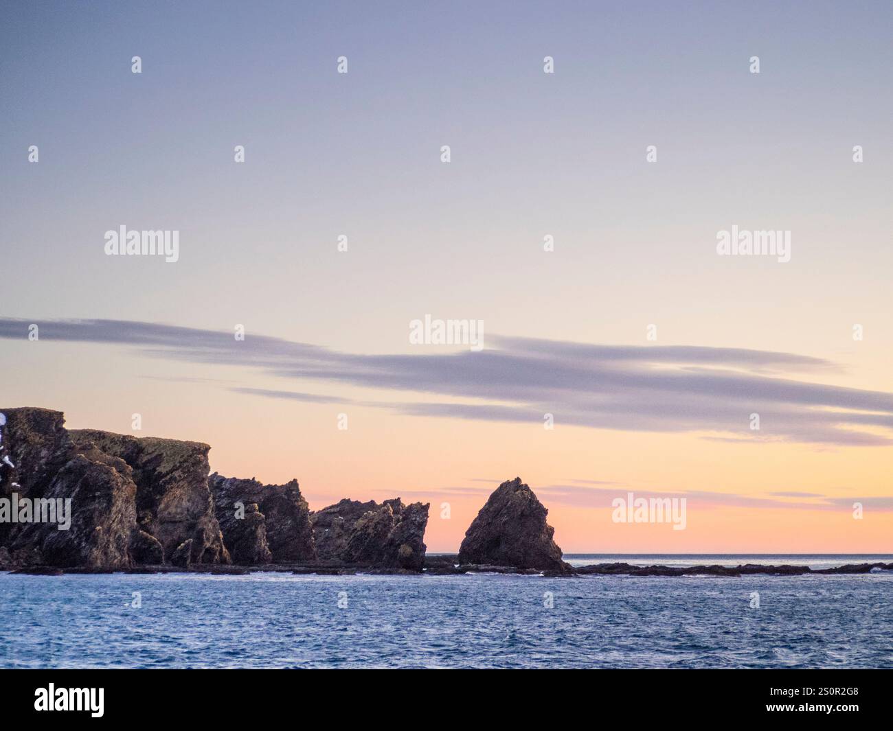 Sunrise behind Gold Point, Gold Harbour, South Georgia Stock Photo - Alamy