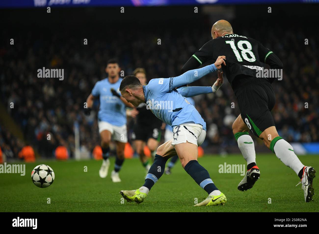 Phil Foden, Gernot Trauner in action during the UEFA 2024 Champions ...