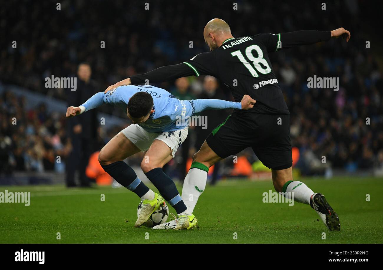 Phil Foden, Gernot Trauner in action during the UEFA 2024 Champions ...