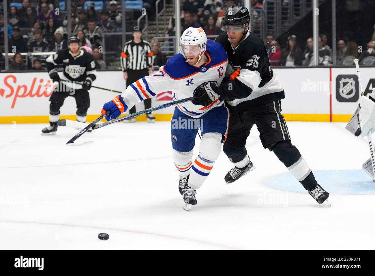 Edmonton Oilers center Connor McDavid, left, and Los Angeles Kings ...