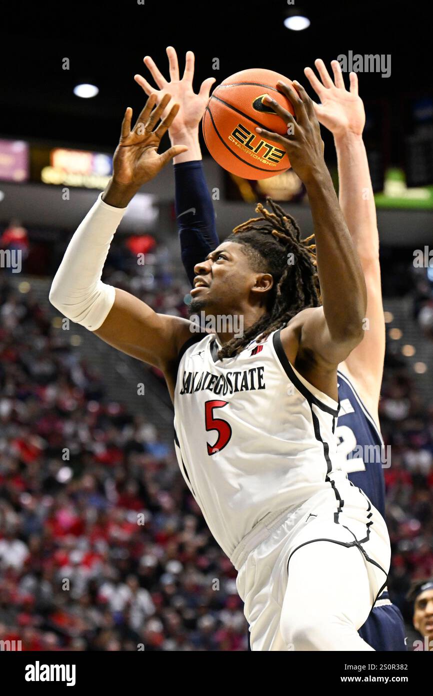 San Diego State forward Pharaoh Compton (5) shoots in front of Utah ...