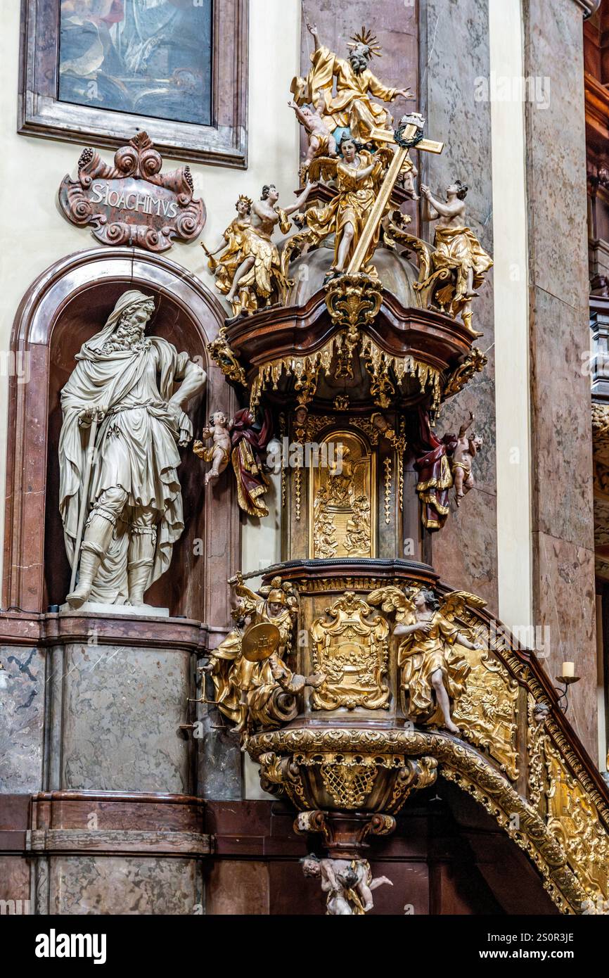 Statue of Saint Joachim and Baroque pulpit inside the church St ...