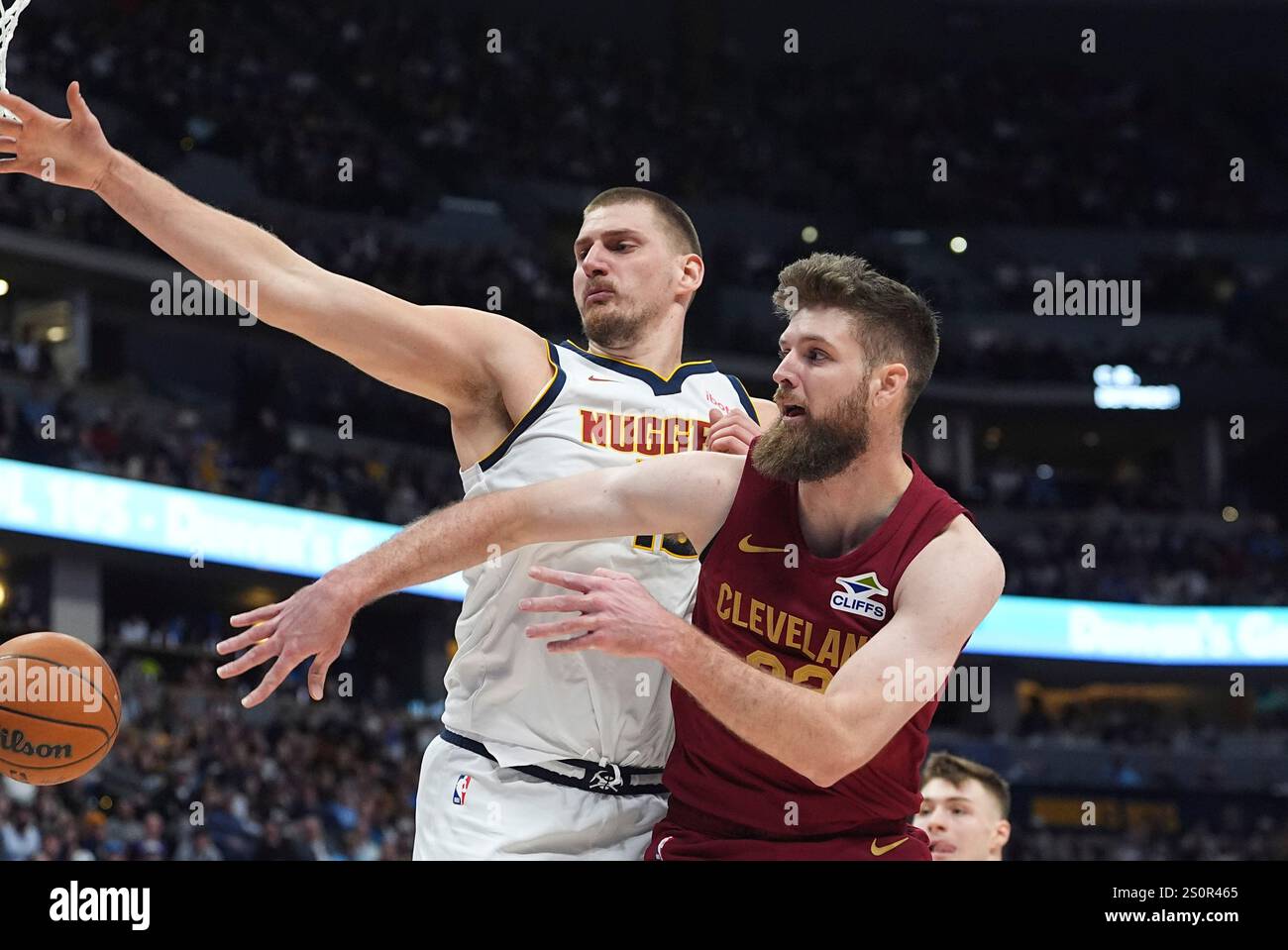 Cleveland Cavaliers forward Dean Wade (32) passes the ball past Denver ...