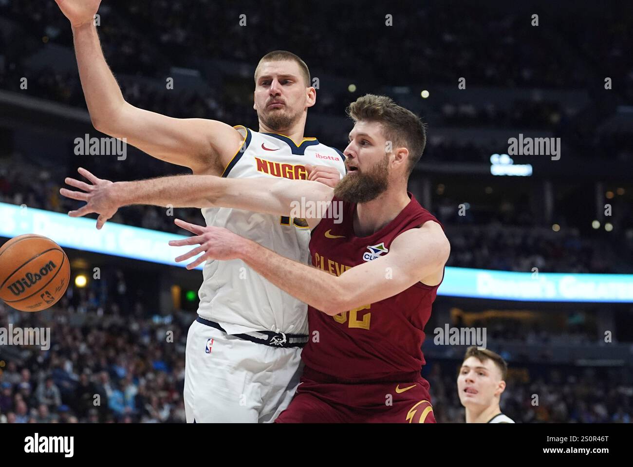 Cleveland Cavaliers forward Dean Wade (32) passes the ball as Denver ...