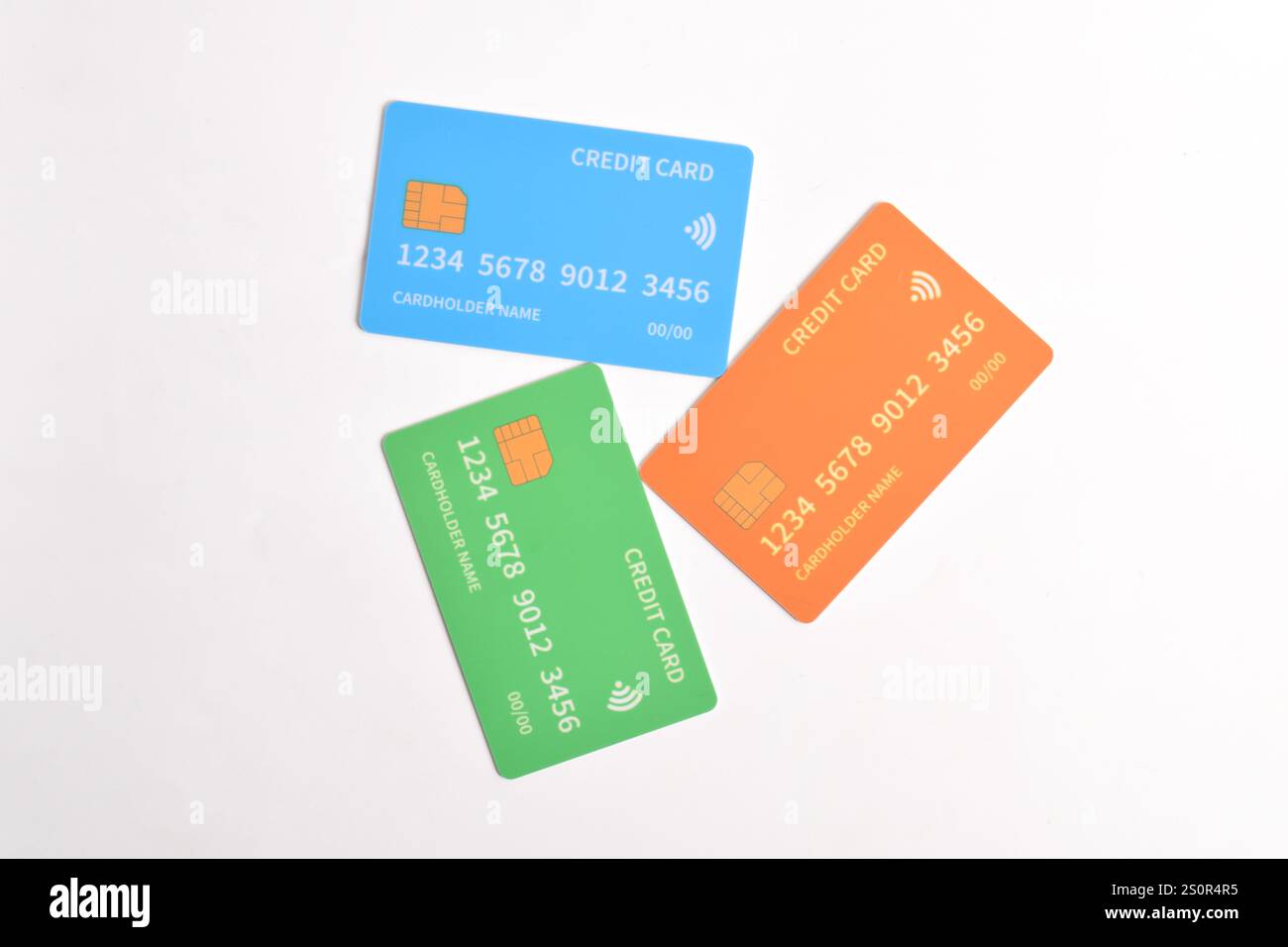 Three credit cards with chip on white background. Green, blue, orange ...