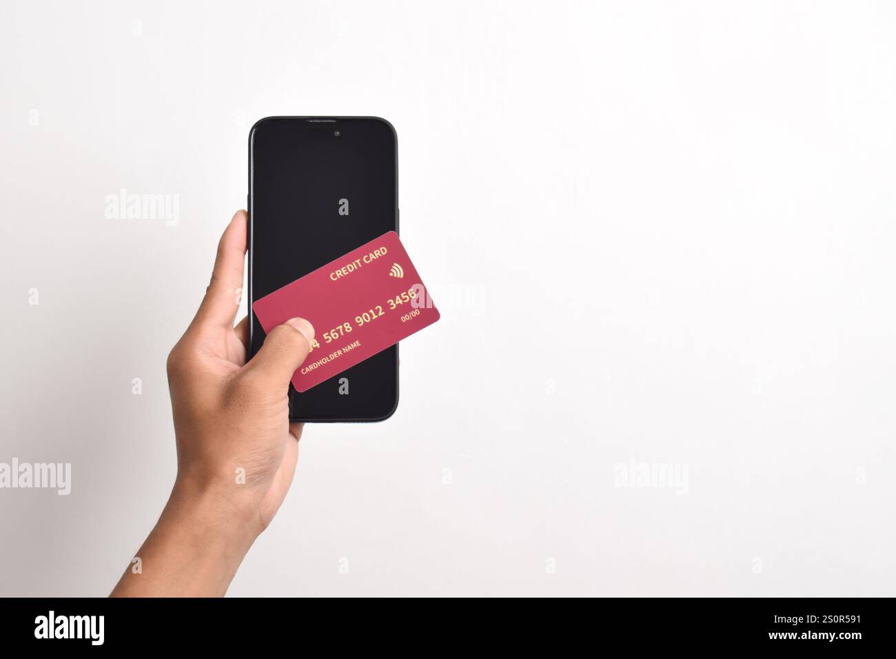 Male hands holding mobile phone and credit card isolated on white ...