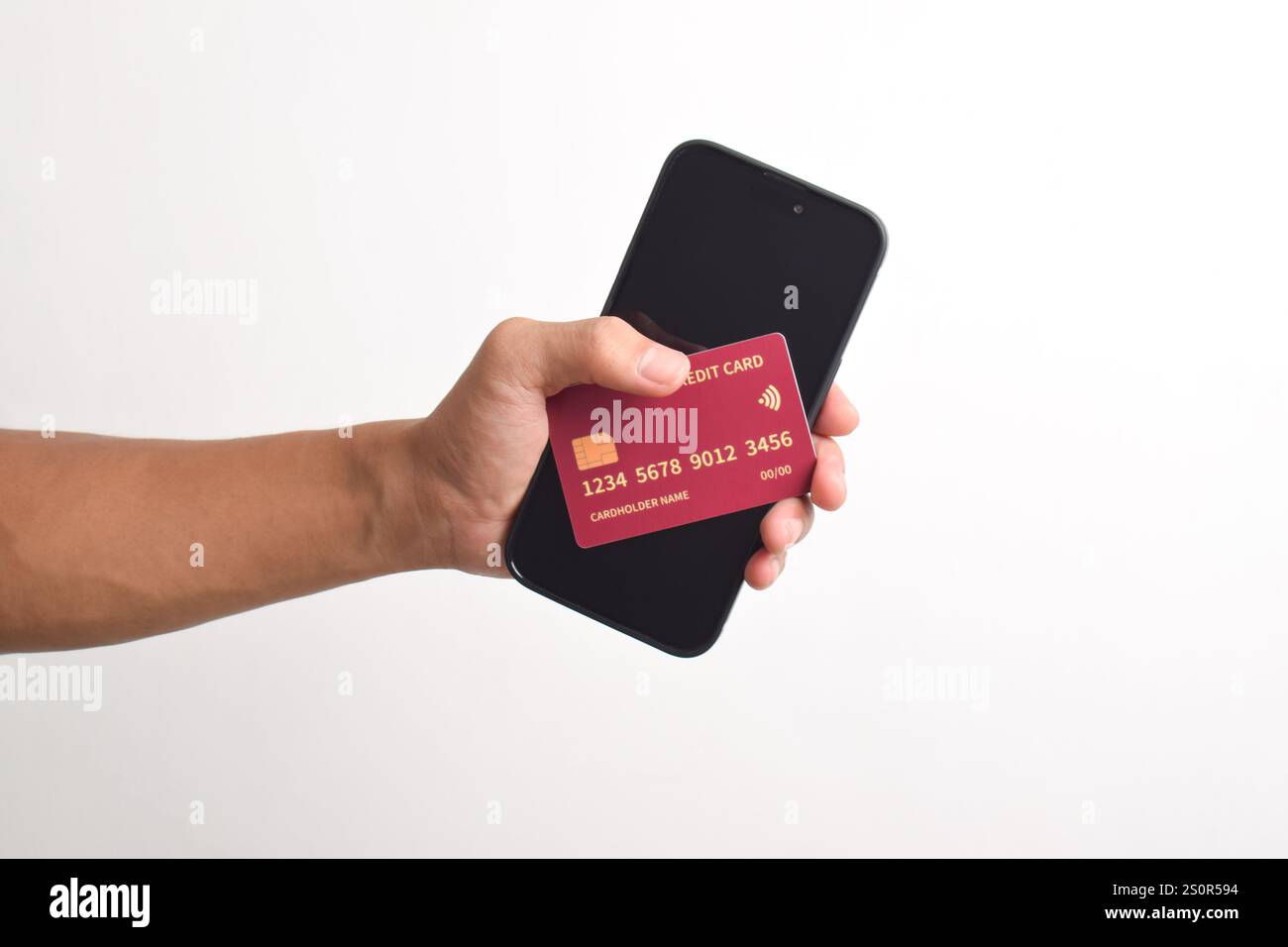 Male hands holding mobile phone and credit card isolated on white ...