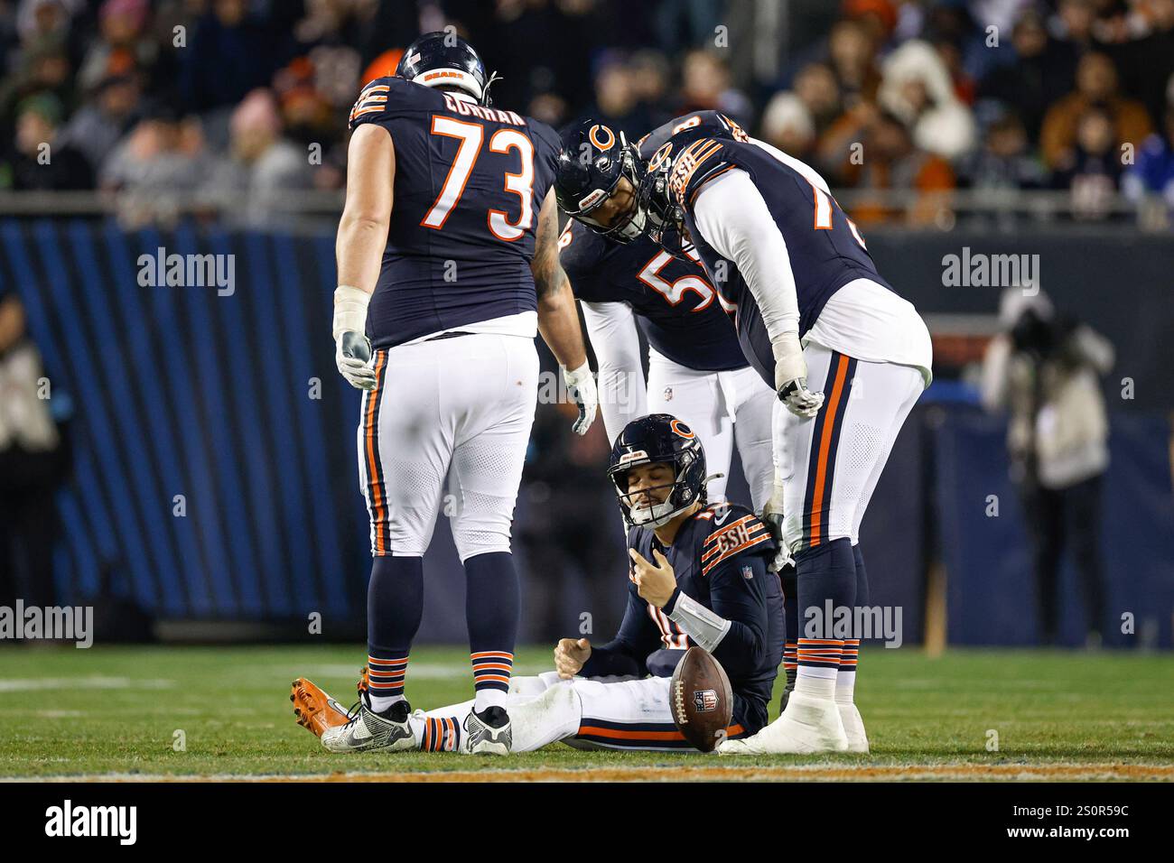Chicago Bears quarterback Caleb Williams (18) reacts after being sacked ...