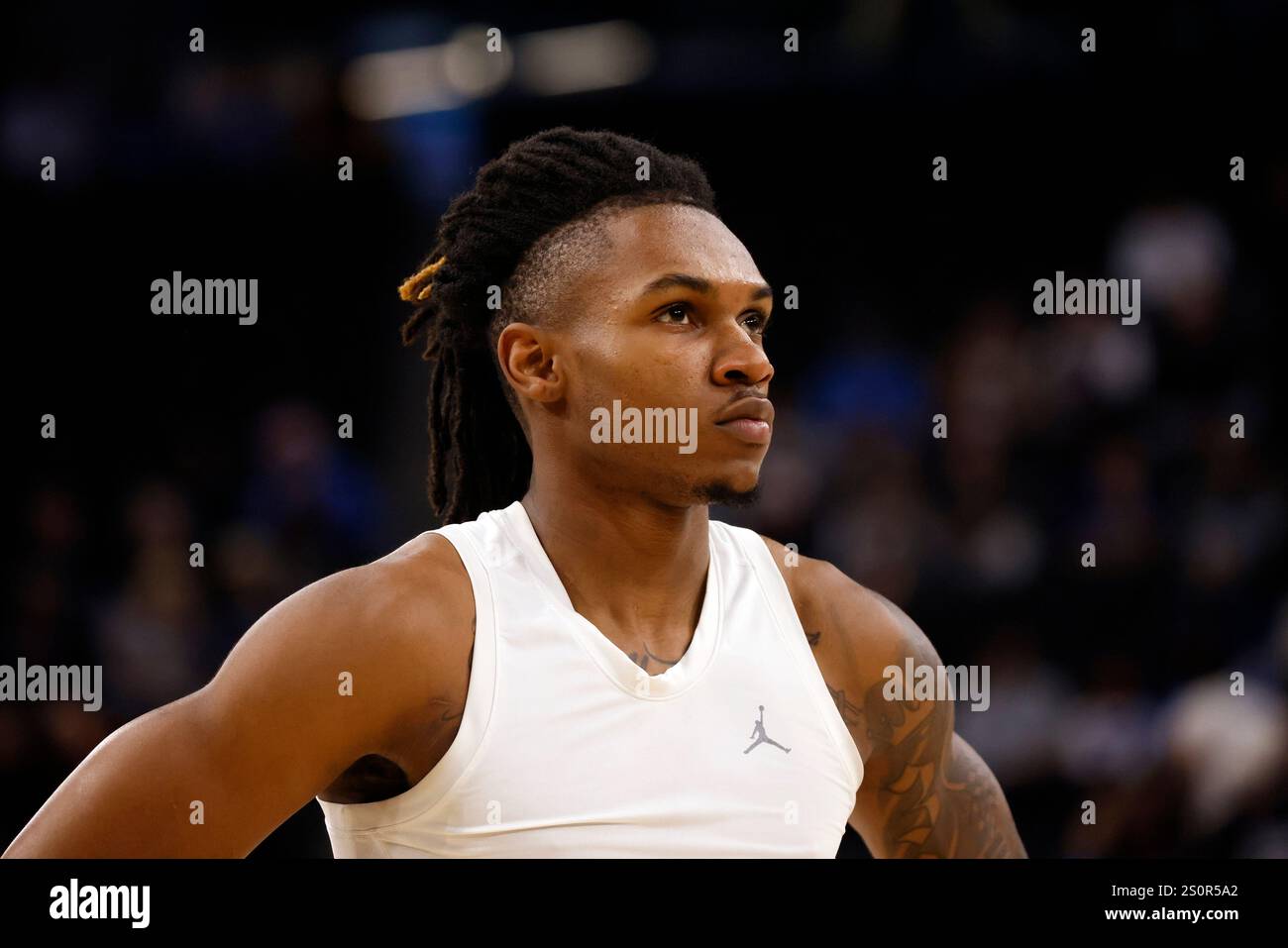 UCLA's Dylan Andrews warms up prior to an NCAA college basketball game ...