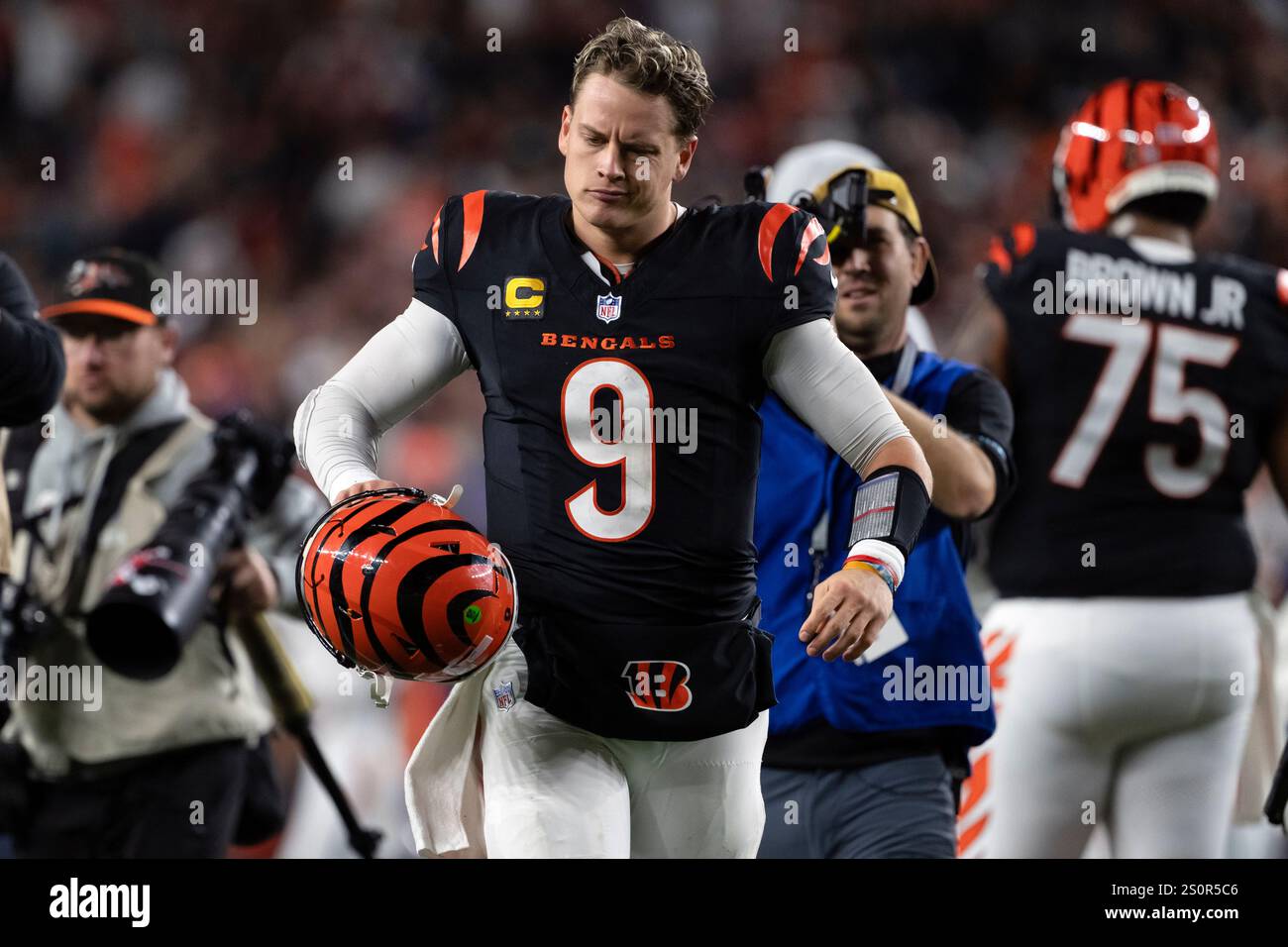 Cincinnati Bengals quarterback Joe Burrow tosses his helmet after ...