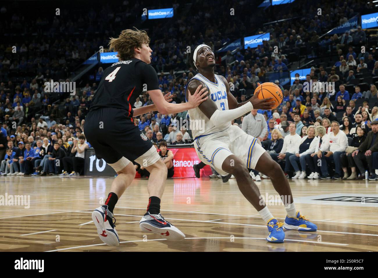 UCLA's Eric Dailey Jr., right, score against Gonzaga Bulldogs' Dusty ...