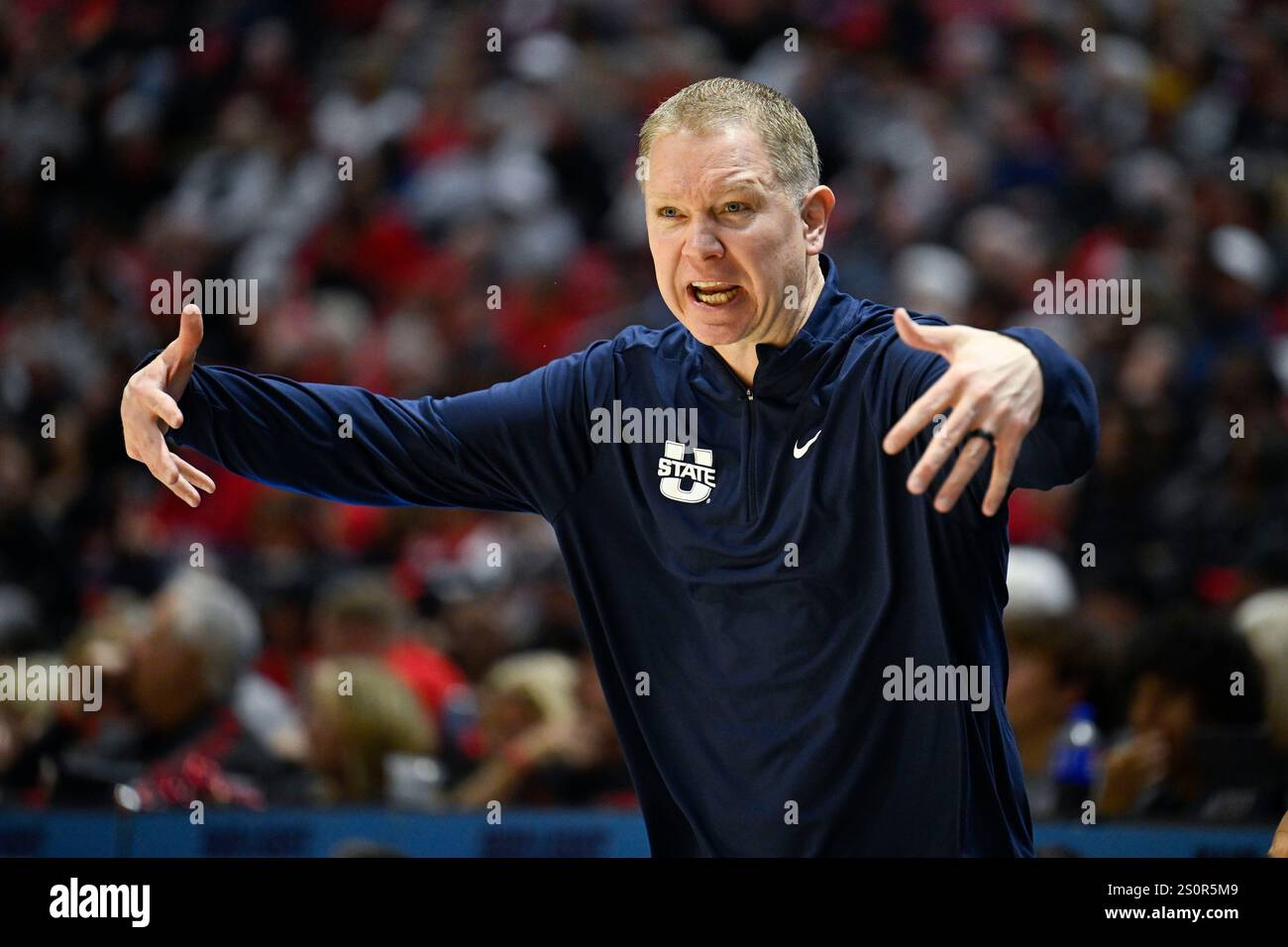 Utah State head coach Jerrod Calhoun yells from the sideline during the ...