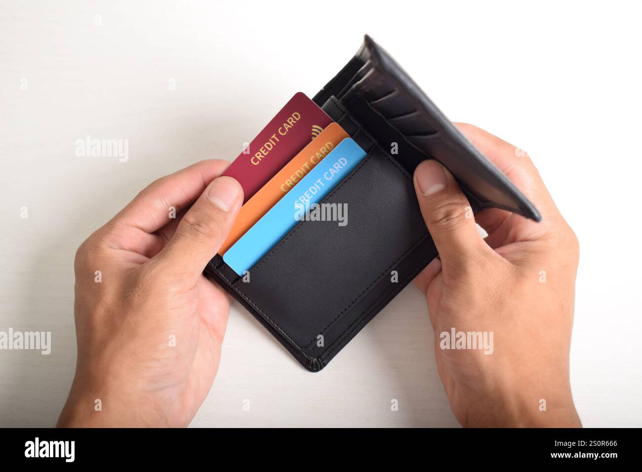 Hand taking out credit card from wallet isolated on white background ...