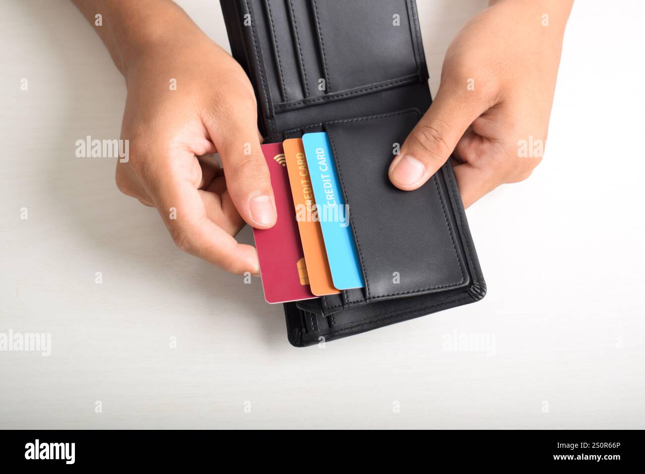 Hand taking out credit card from wallet isolated on white background ...